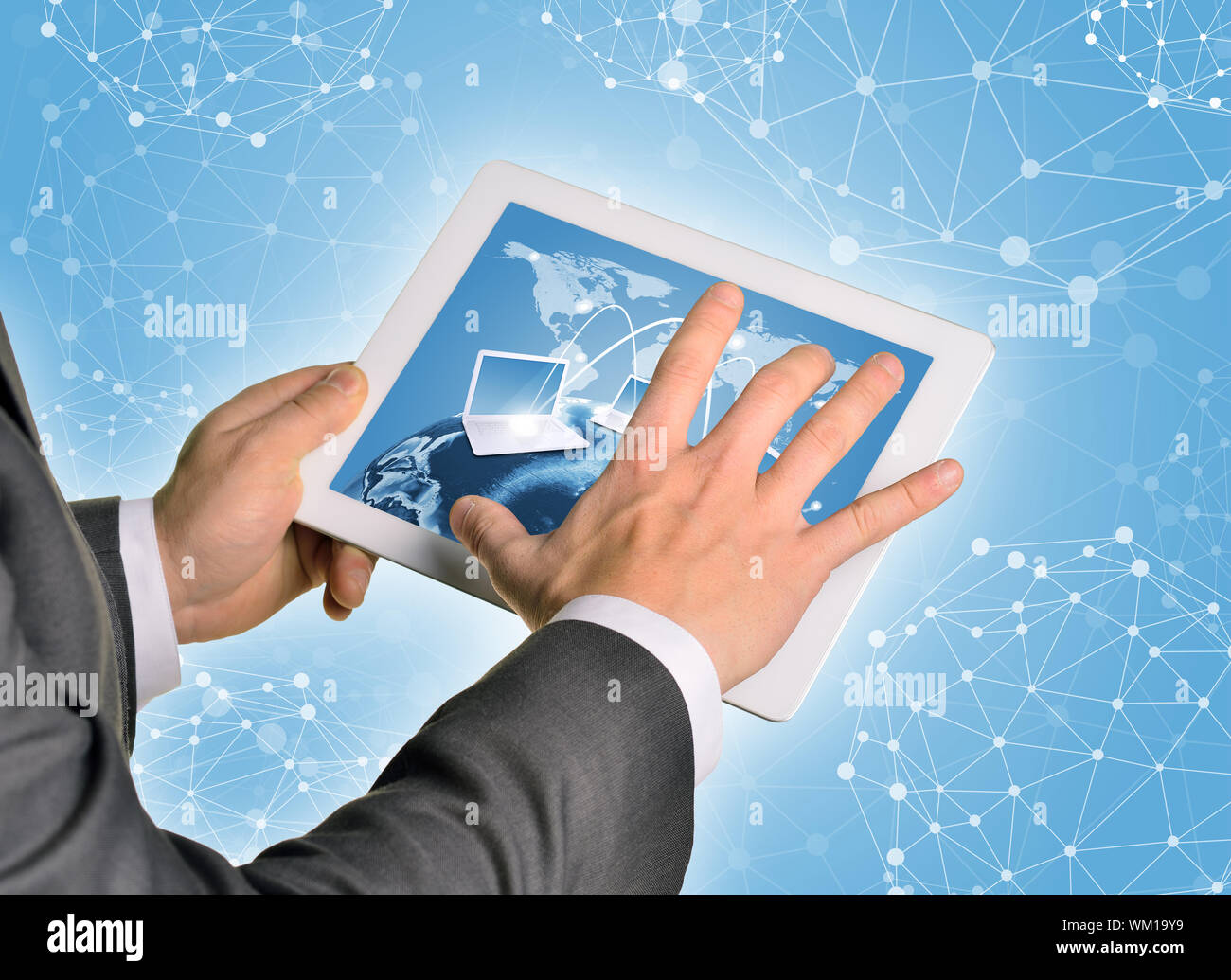 Man hands using tablet pc. Image of Earth and laptops on tablet screen ...