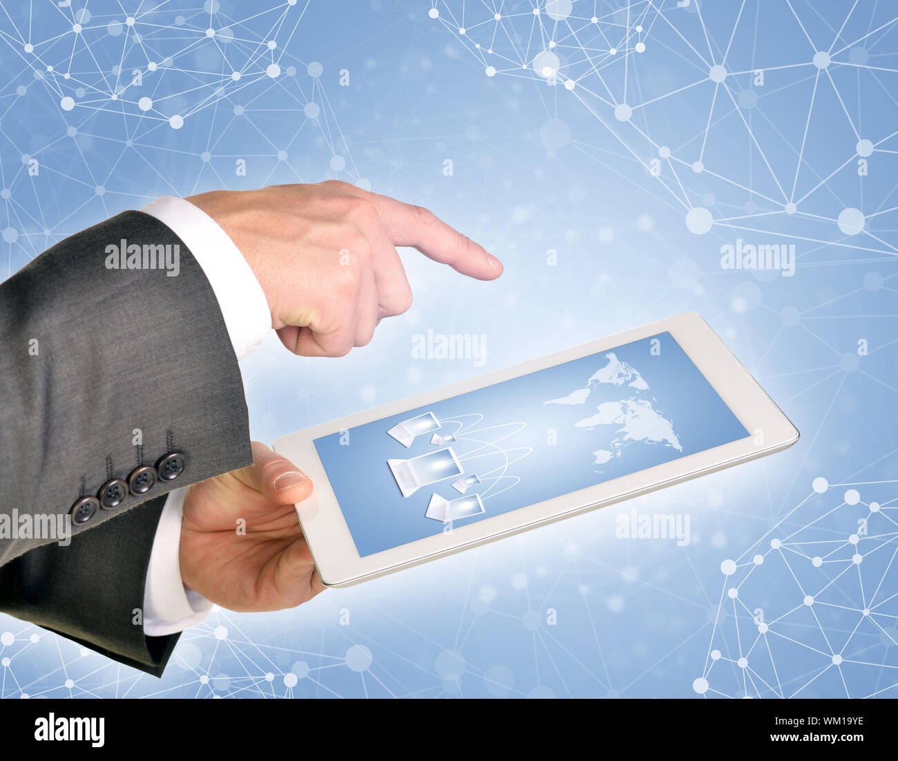 Man hands using tablet pc. Image of world map and laptops on tablet ...