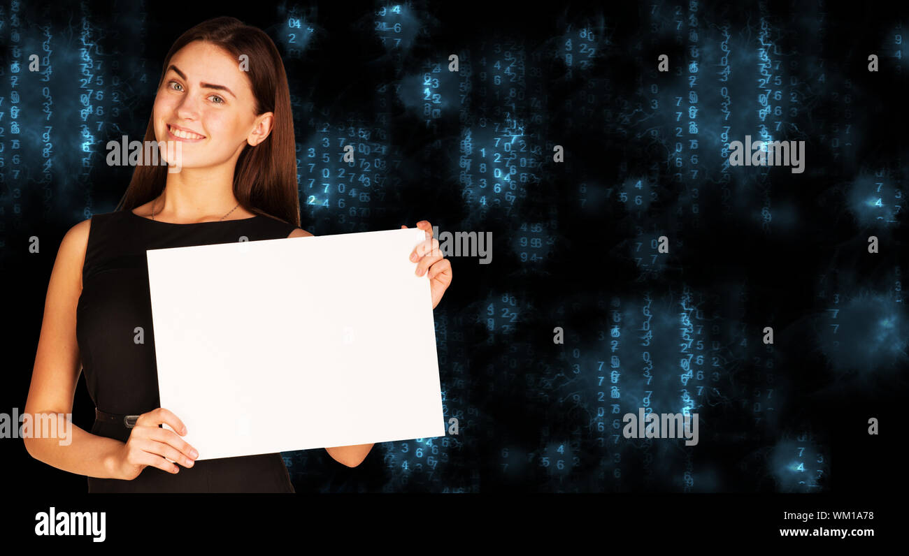 Businesswoman holding empty paper. Blue glowing figures as backdrop ...