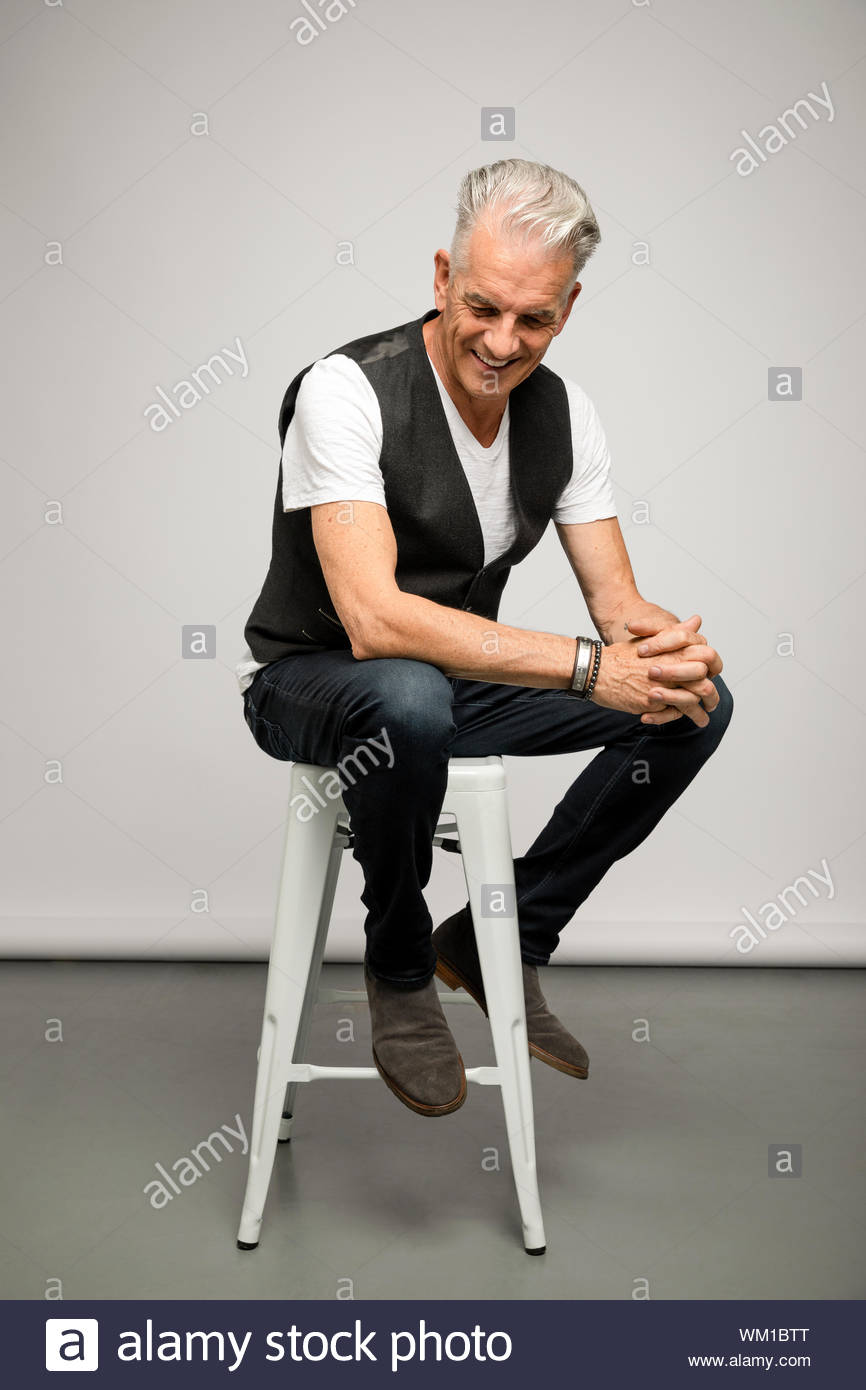 Man on stool hi-res stock photography and images - Alamy