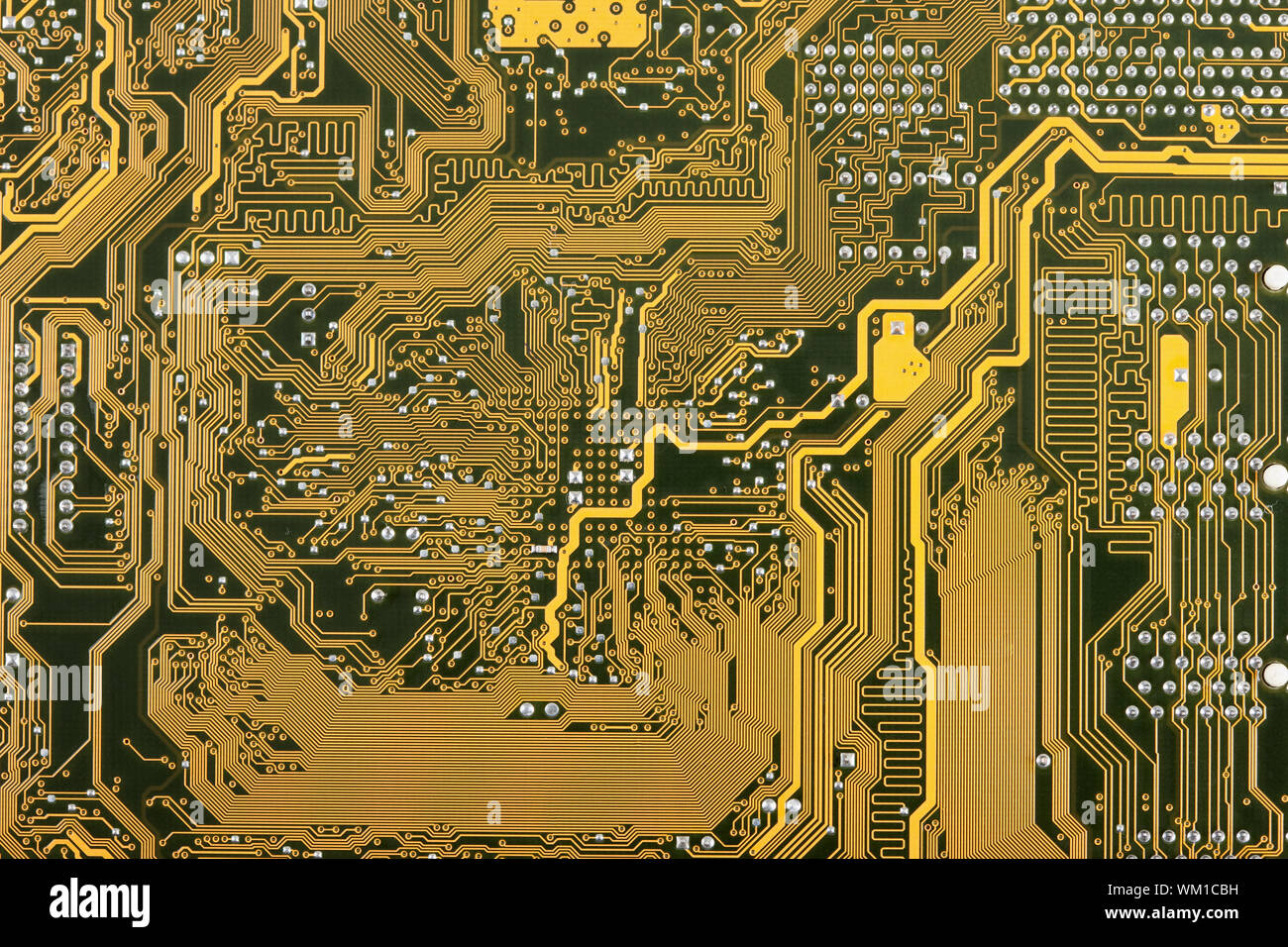 Golden industrial circuit board electronic background Stock Photo - Alamy