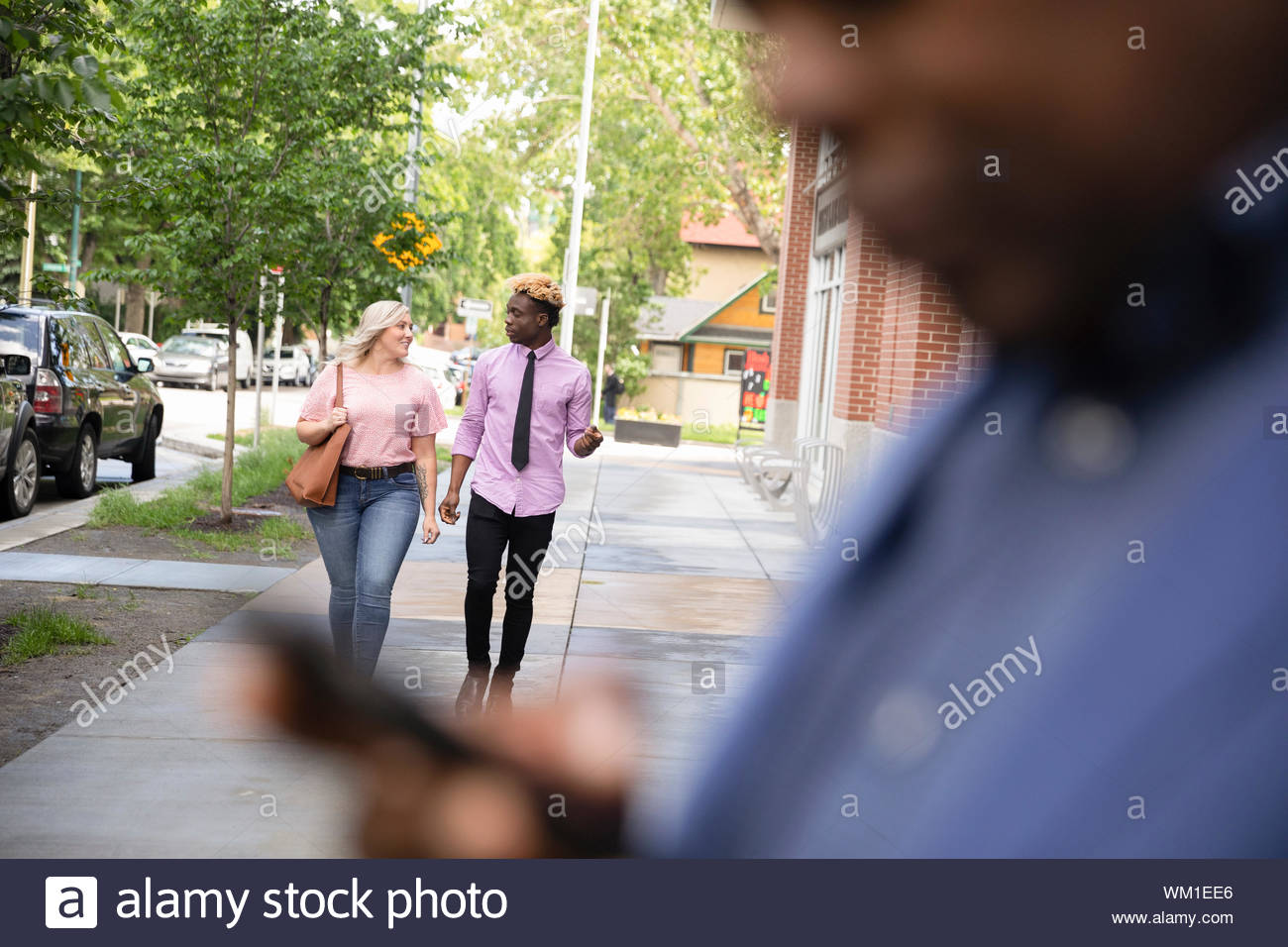 Business people talking and walking on urban sidewalk Stock Photo - Alamy