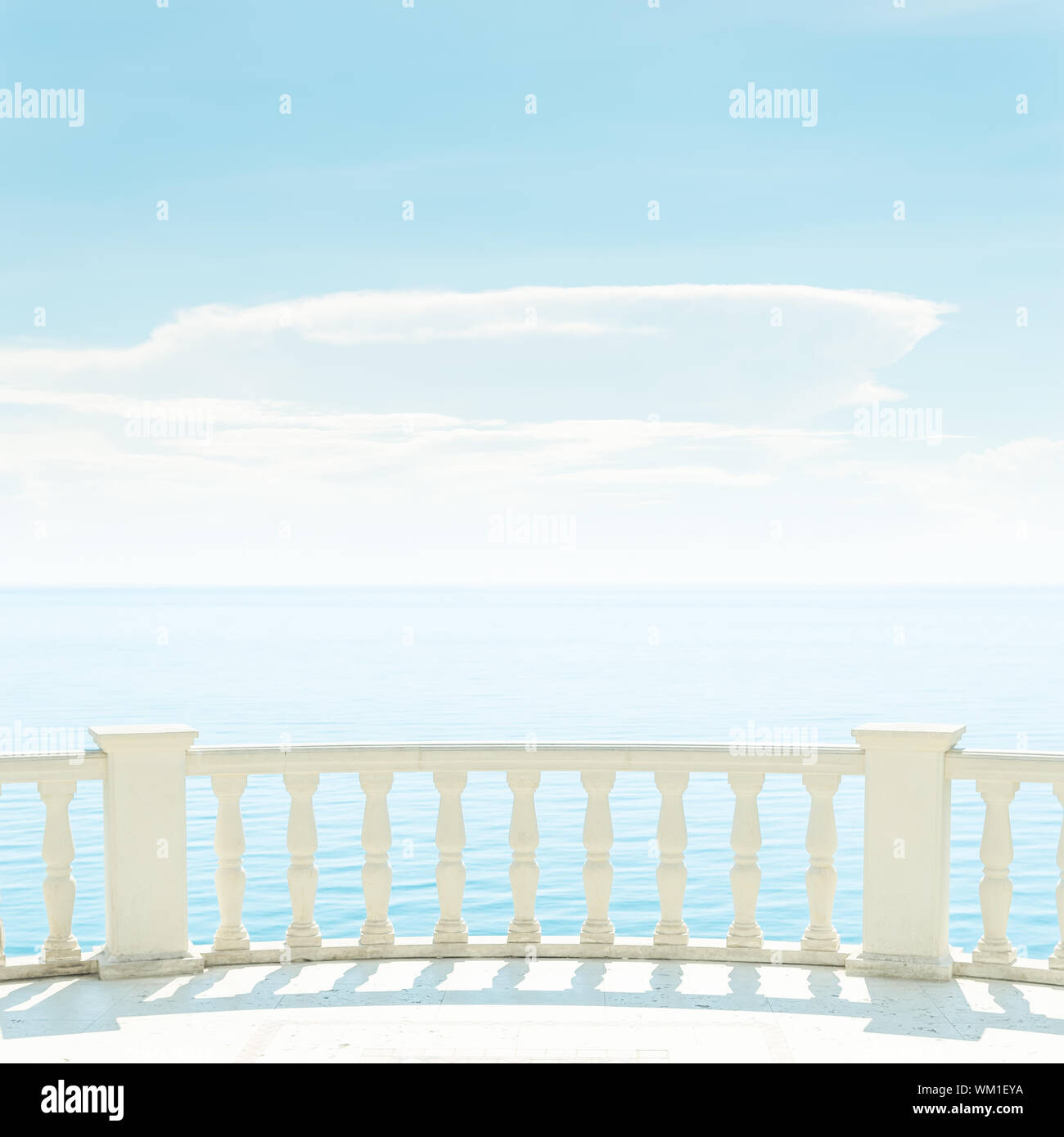 balcony over sea and light clouds in blue sky Stock Photo - Alamy