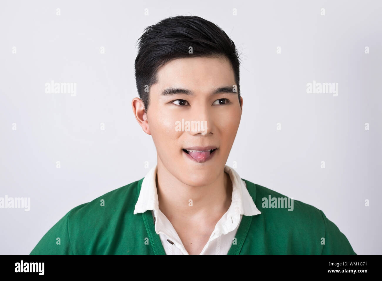 Funny facial expression, closeup Asian young man Stock Photo - Alamy