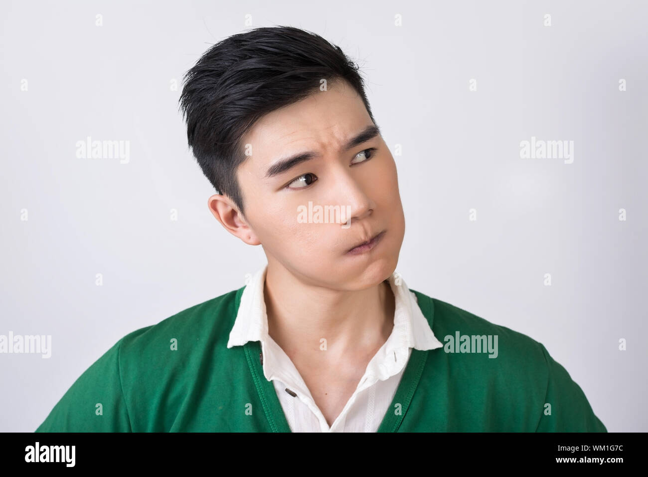 Funny facial expression, closeup Asian young man Stock Photo - Alamy