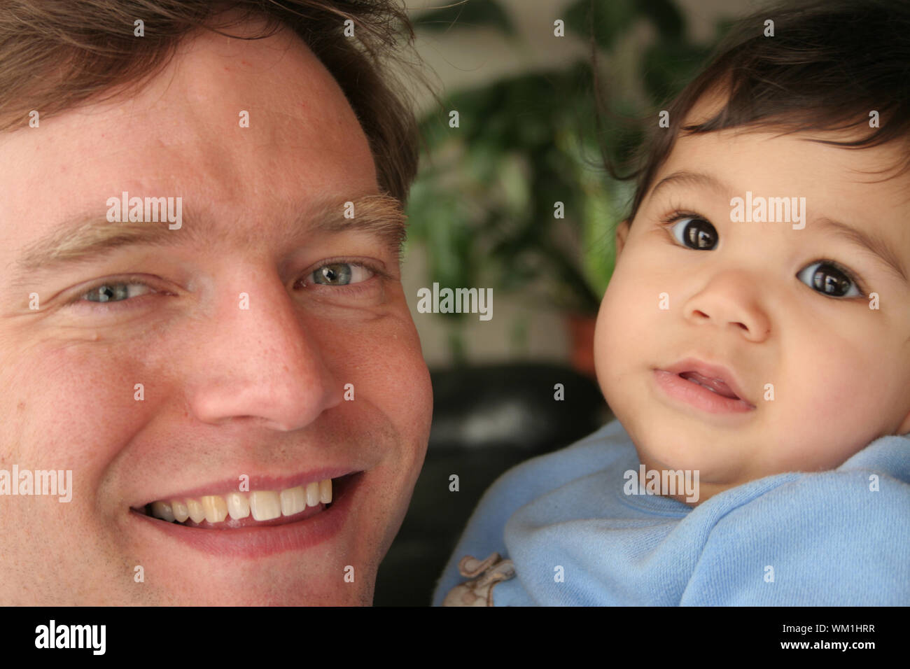 Smiling father and baby Stock Photo - Alamy