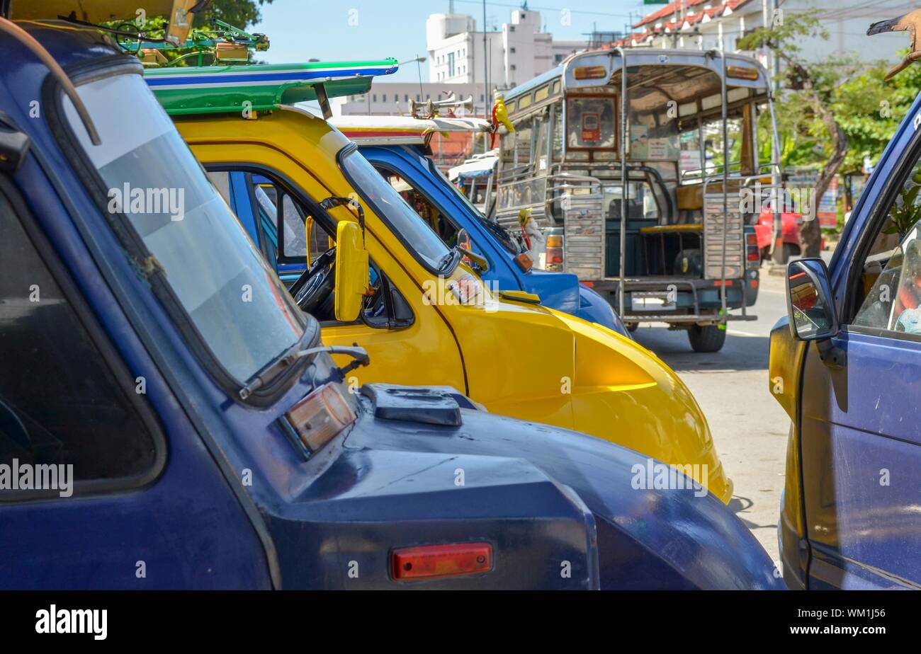 Colorful cars parked in a busy street Stock Photo - Alamy