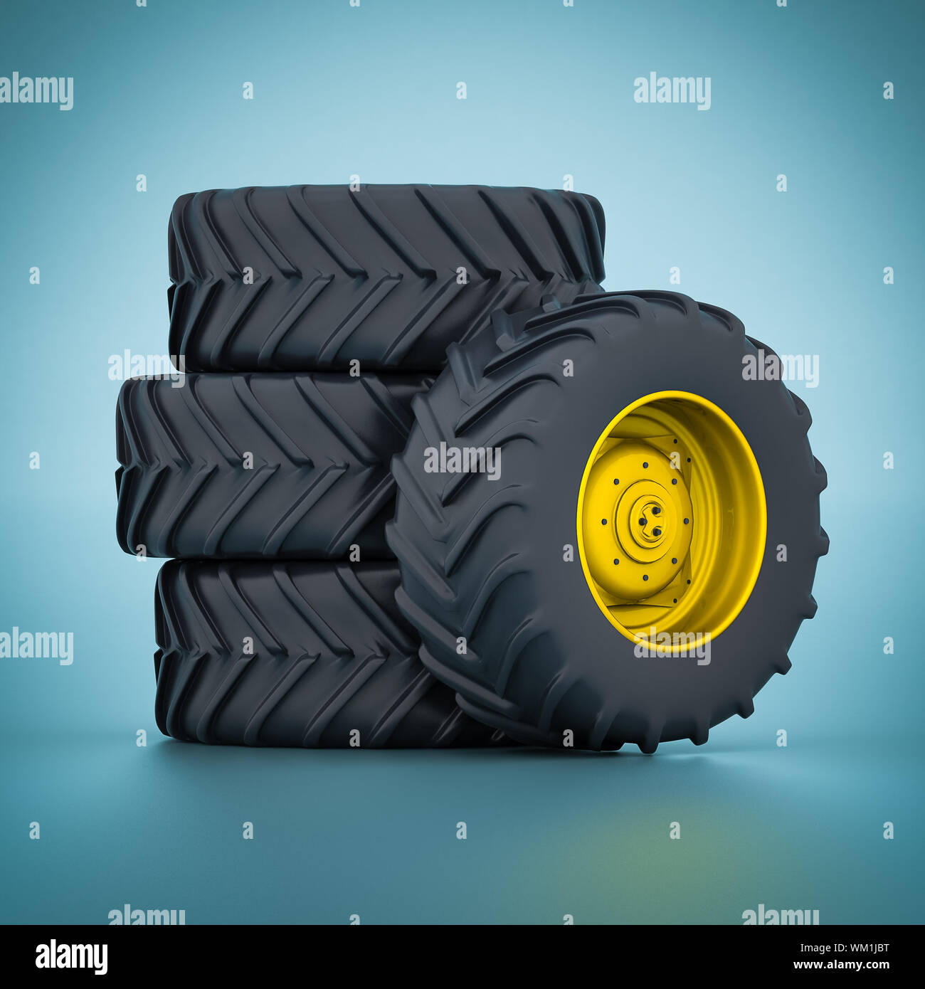 Tractor wheels isolated on blue background Stock Photo - Alamy