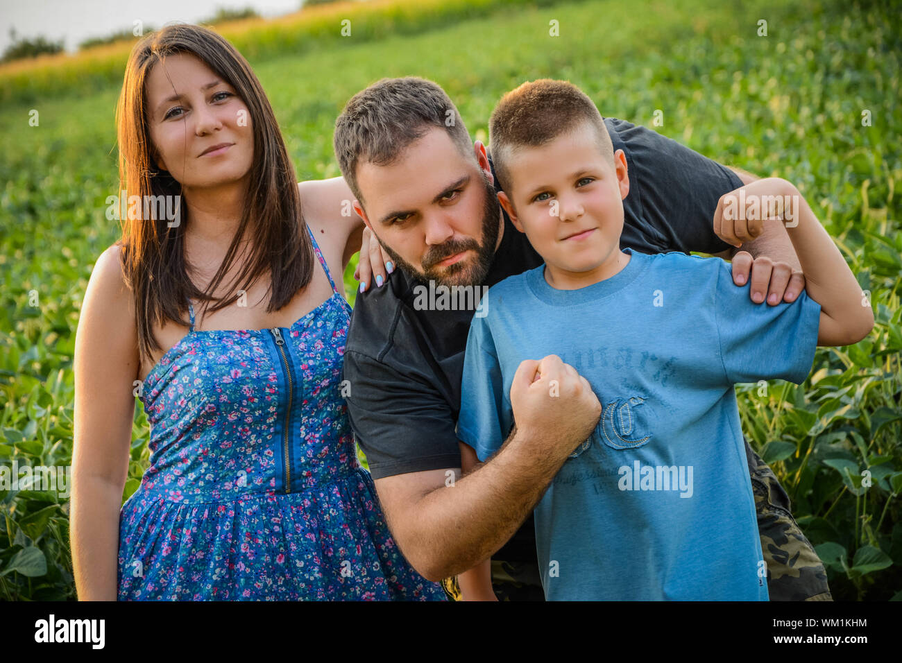 Father son flexing muscles hi-res stock photography and images - Alamy