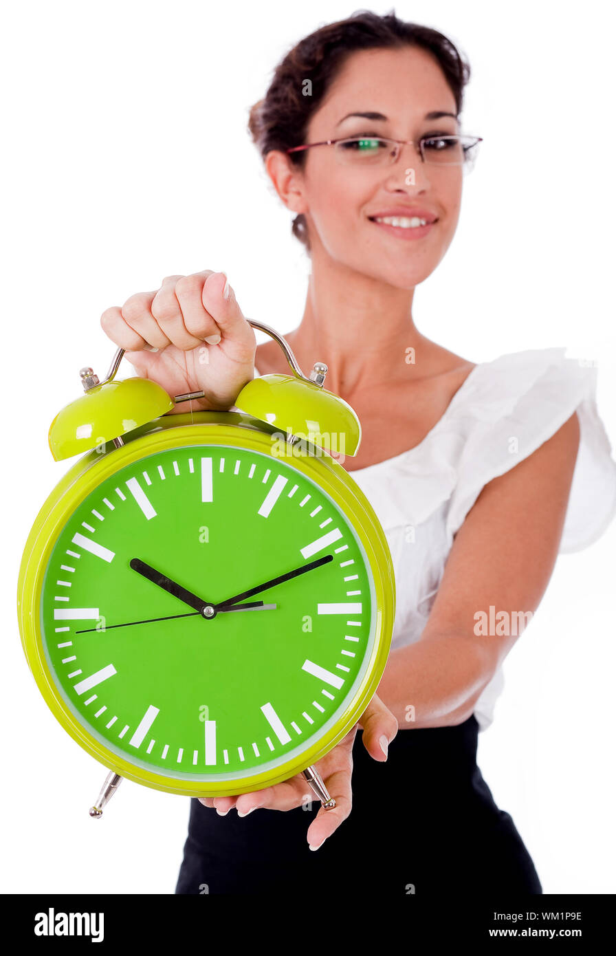 Young business womanshowing a green color clock on isolated white ...