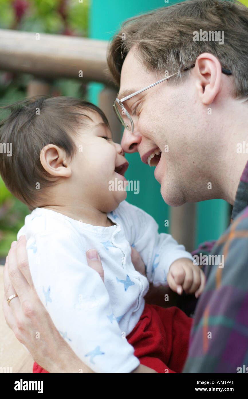 Loving interaction between father and son Stock Photo - Alamy