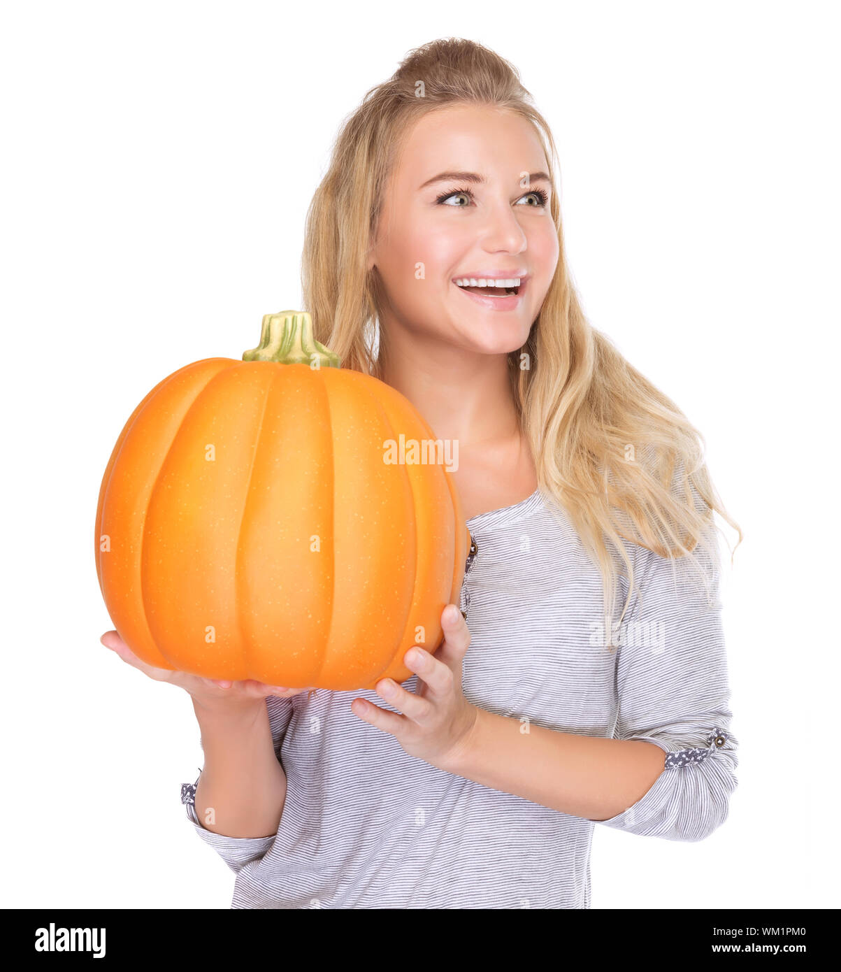 Cheerful female with festive pumpkin Stock Photo - Alamy