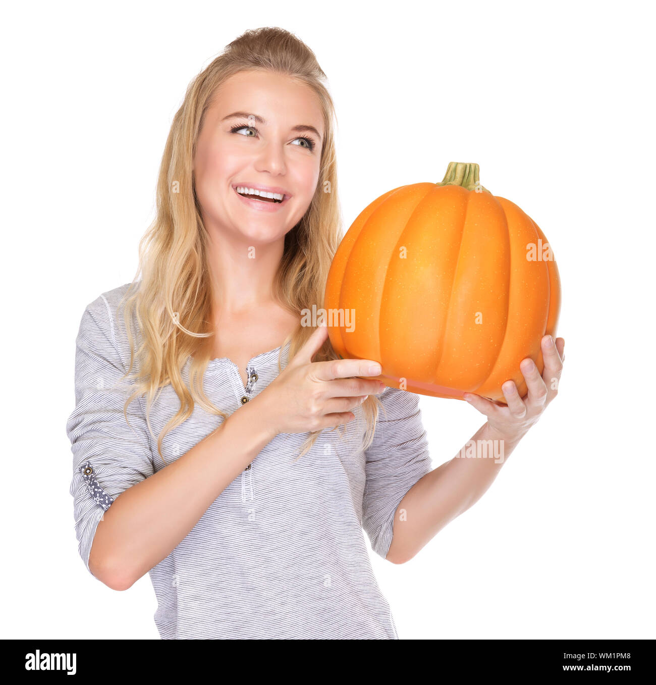 Happy woman with Thanksgiving pumpkin Stock Photo - Alamy