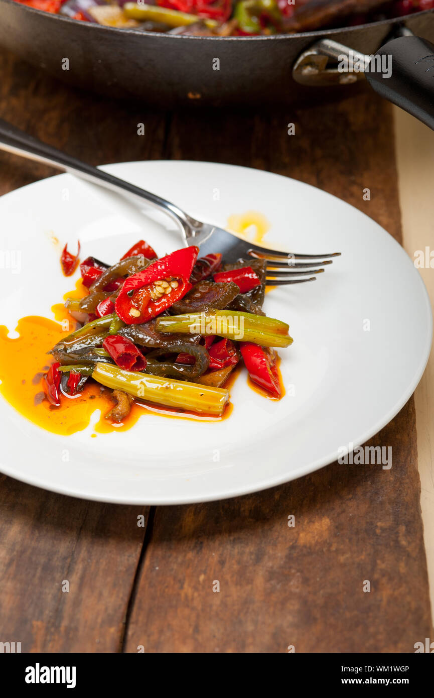 fried chili pepper and vegetable on a iron wok pan Stock Photo - Alamy