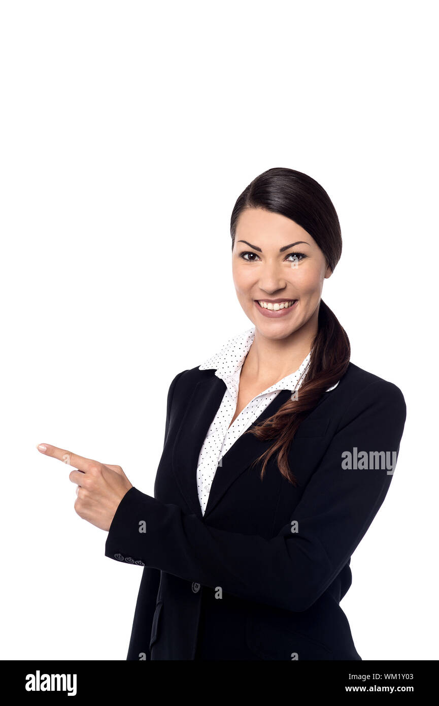 Young woman executive pointing at something Stock Photo - Alamy