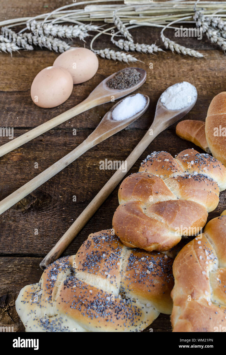 Roll, pastry from home bakery on wood table with wheat Stock Photo - Alamy