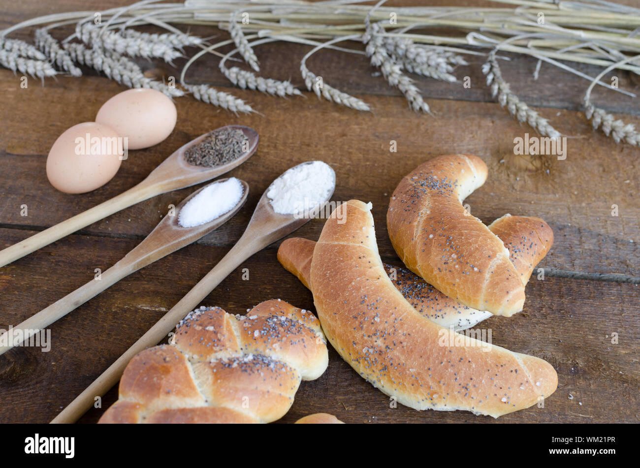 Roll, pastry from home bakery on wood table with wheat Stock Photo - Alamy