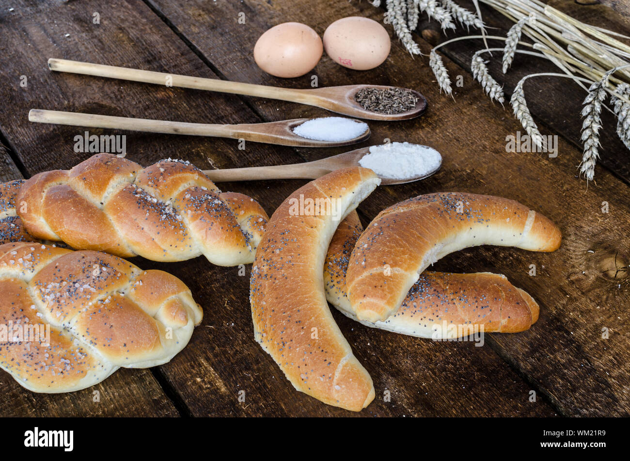 Roll, pastry from home bakery on wood table with wheat Stock Photo - Alamy