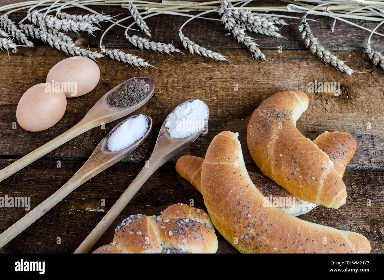 Roll, pastry from home bakery on wood table with wheat Stock Photo - Alamy
