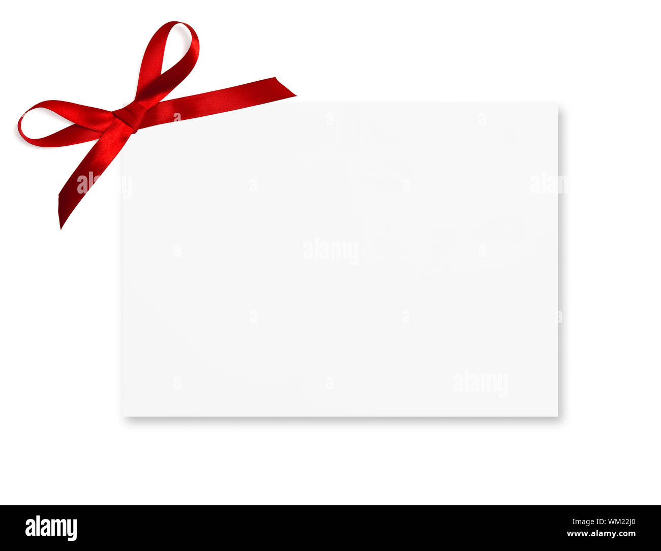 Gift card tied with a bow of red satin ribbon. Isolated on white ...