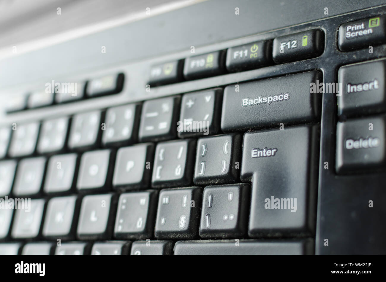 Keyboard with enter button, with light from left side Stock Photo - Alamy