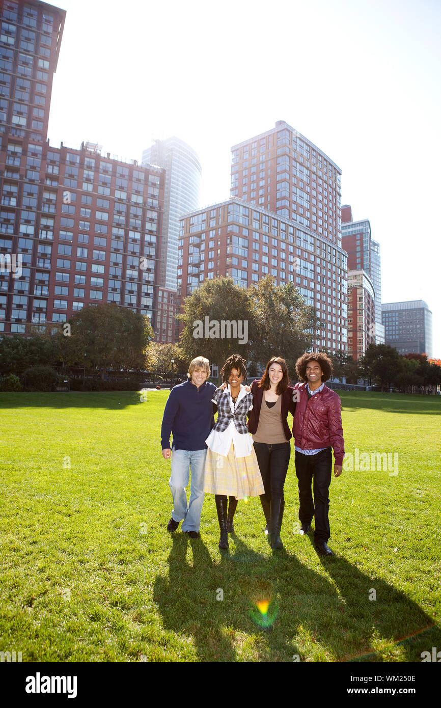A group of college students in a park - shot against the sun with solar ...