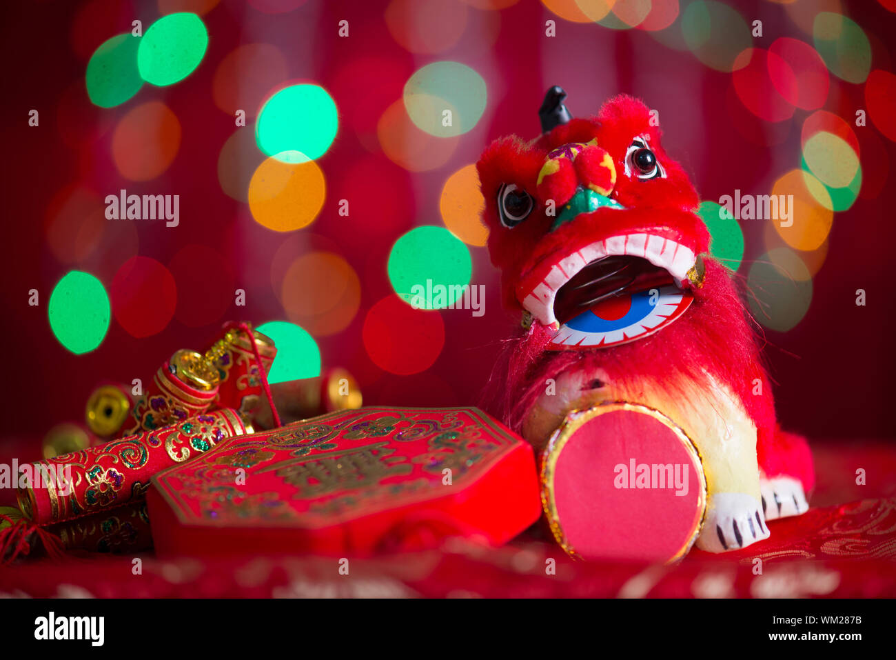 Chinese new year decorations, miniature dancing lion and firecrackers ...