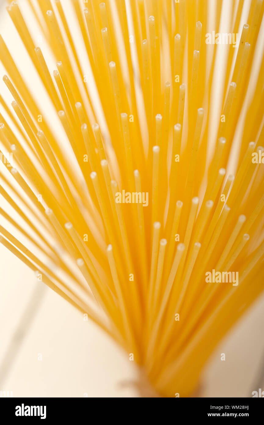 Italian pasta spaghetti tied with a rope on a rustic table Stock Photo ...