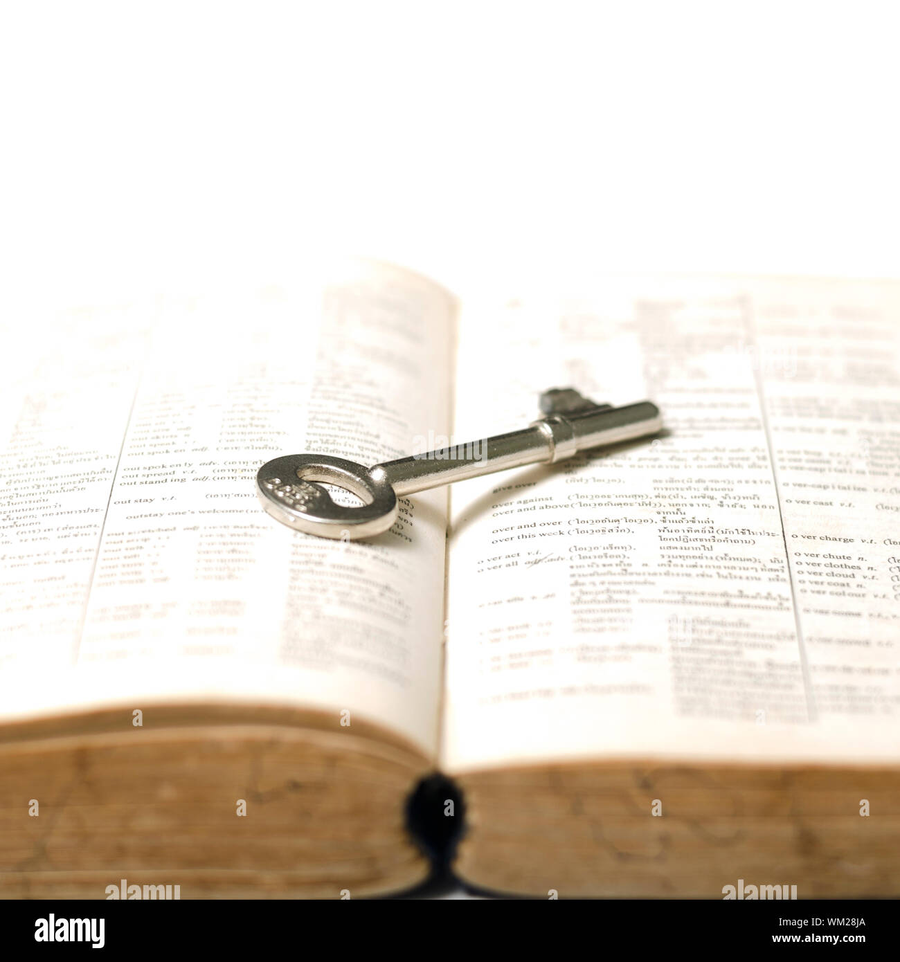 old book with key Stock Photo - Alamy