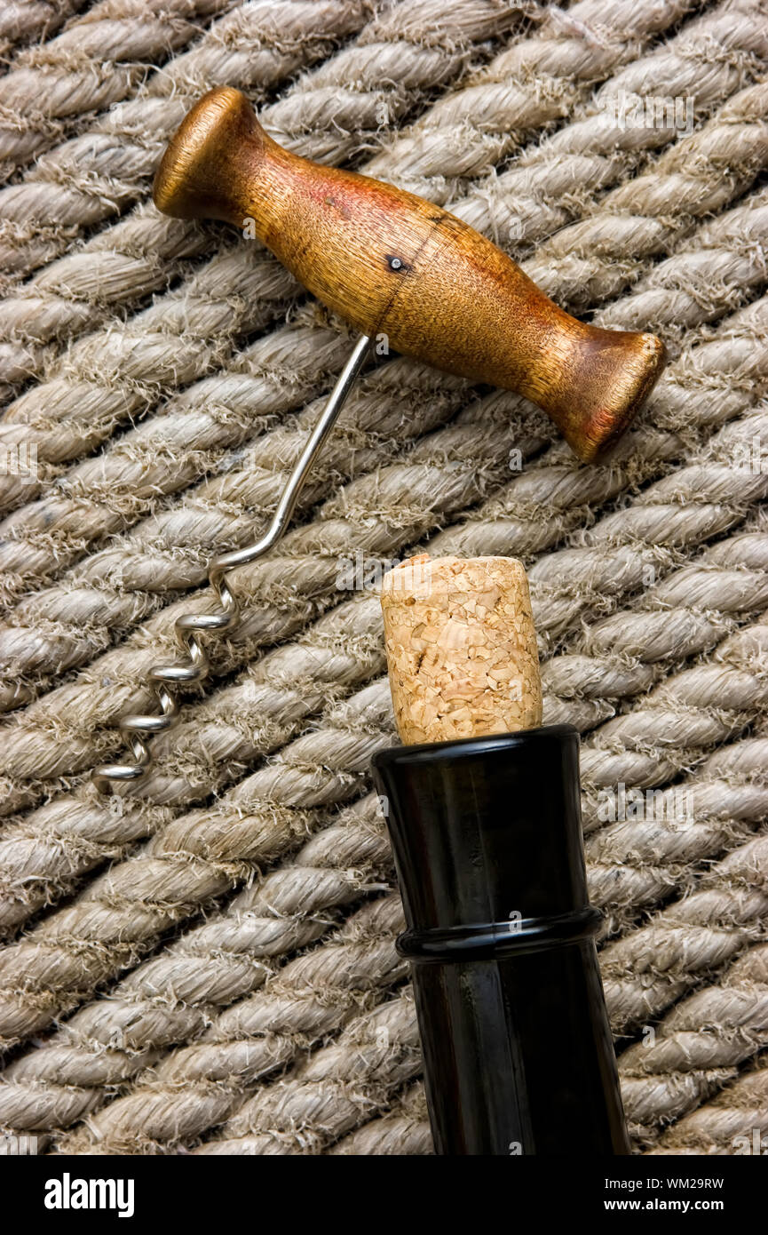 corkscrew with a cork and bottle on the background of the rope Stock ...