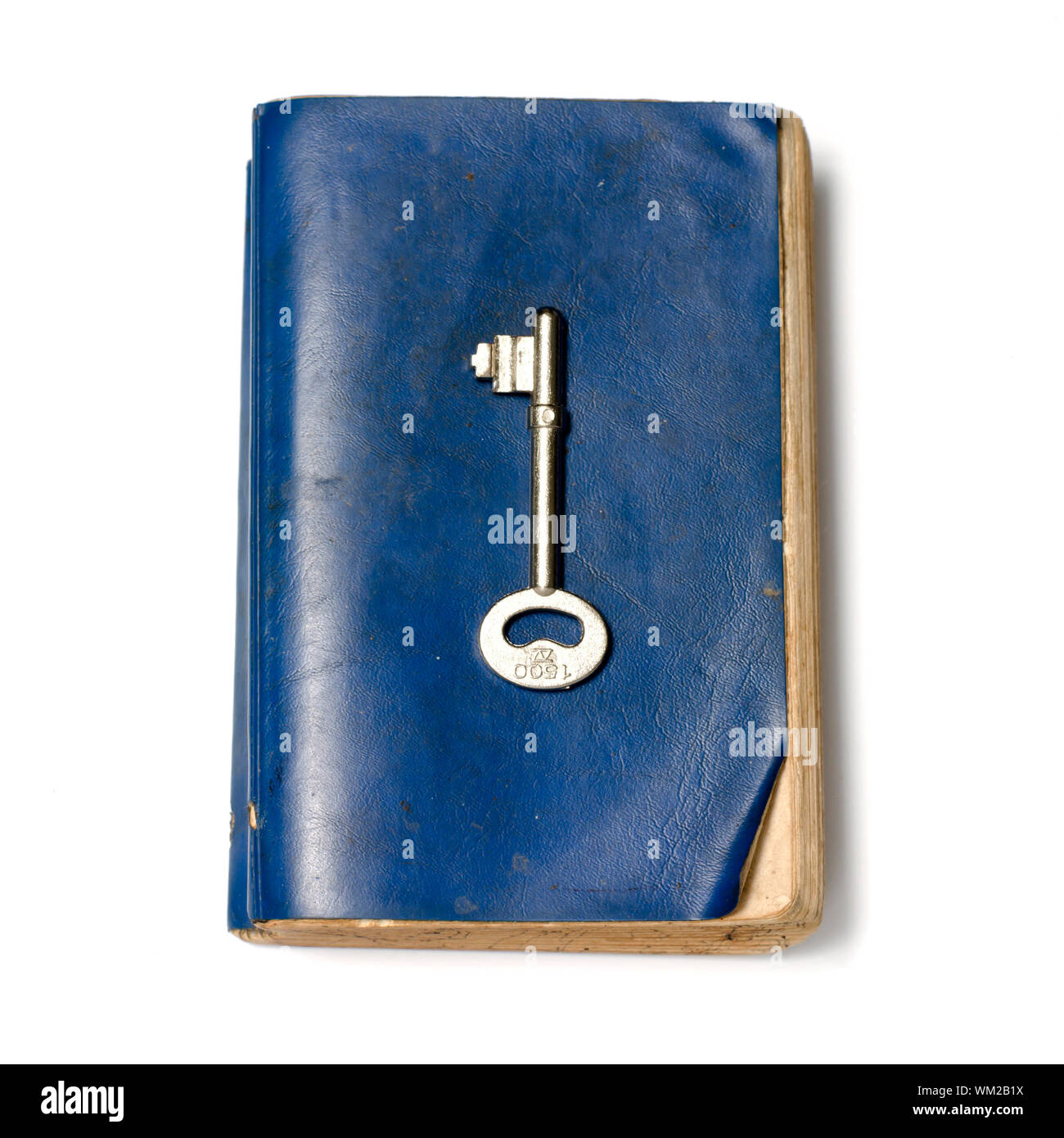 old book with key Stock Photo - Alamy