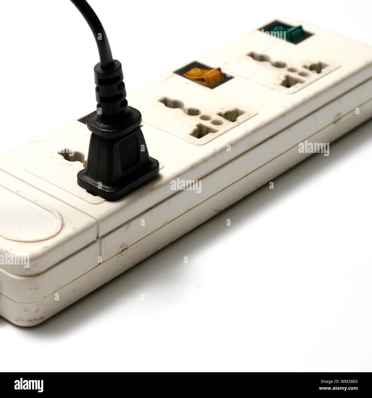 electric multiple socket outlet on a white background Stock Photo - Alamy