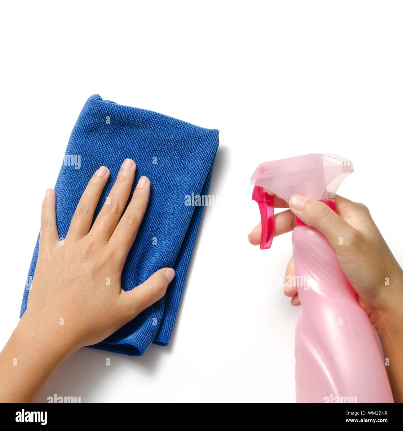 hand cleaning with spray bottle and blue rag Stock Photo - Alamy