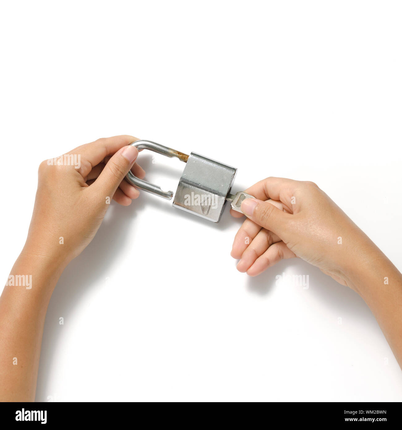 two woman hands open padlock with key on a white background Stock Photo ...