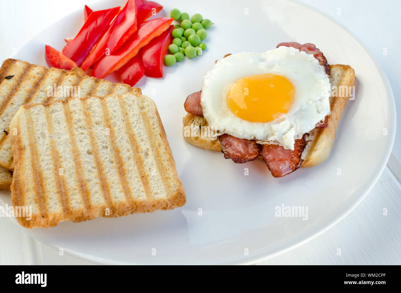 Fresh breakfest - ham, eggs, vegetable and toast homemade Stock Photo ...