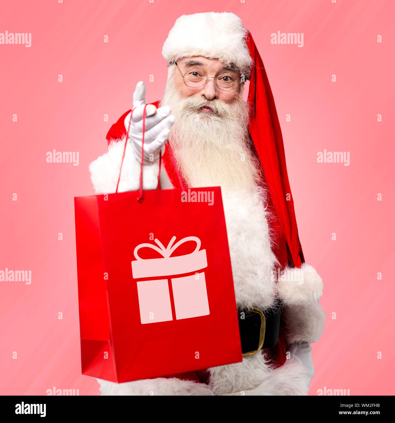 Santa claus distributing gifts hi-res stock photography and images - Alamy