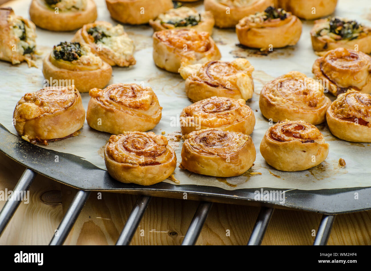Canapés puff pastry with spinach, garlic blue cheese, easy snack Stock ...