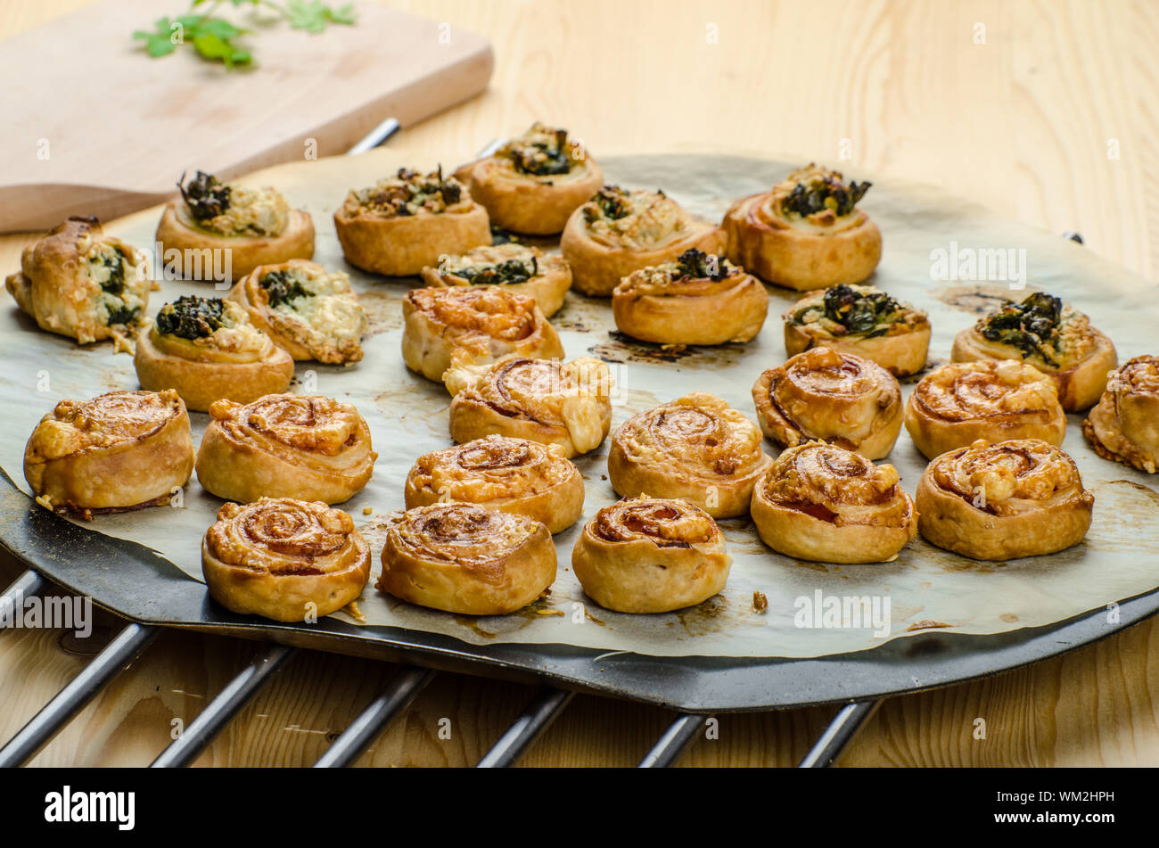 Canapés puff pastry with spinach, garlic blue cheese, easy snack Stock ...