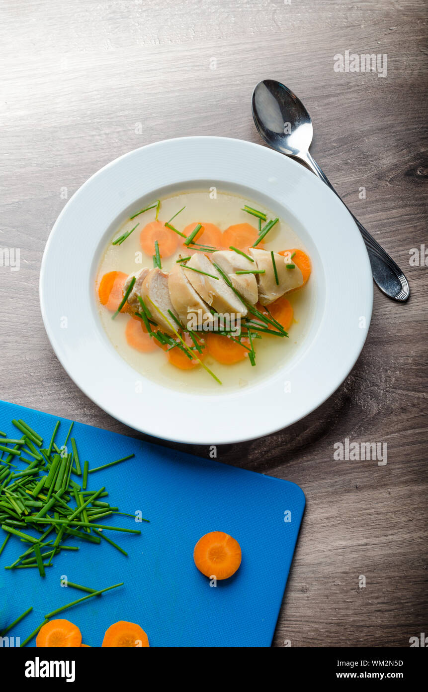 Chicken broth with fresh vegetables and chives Stock Photo - Alamy