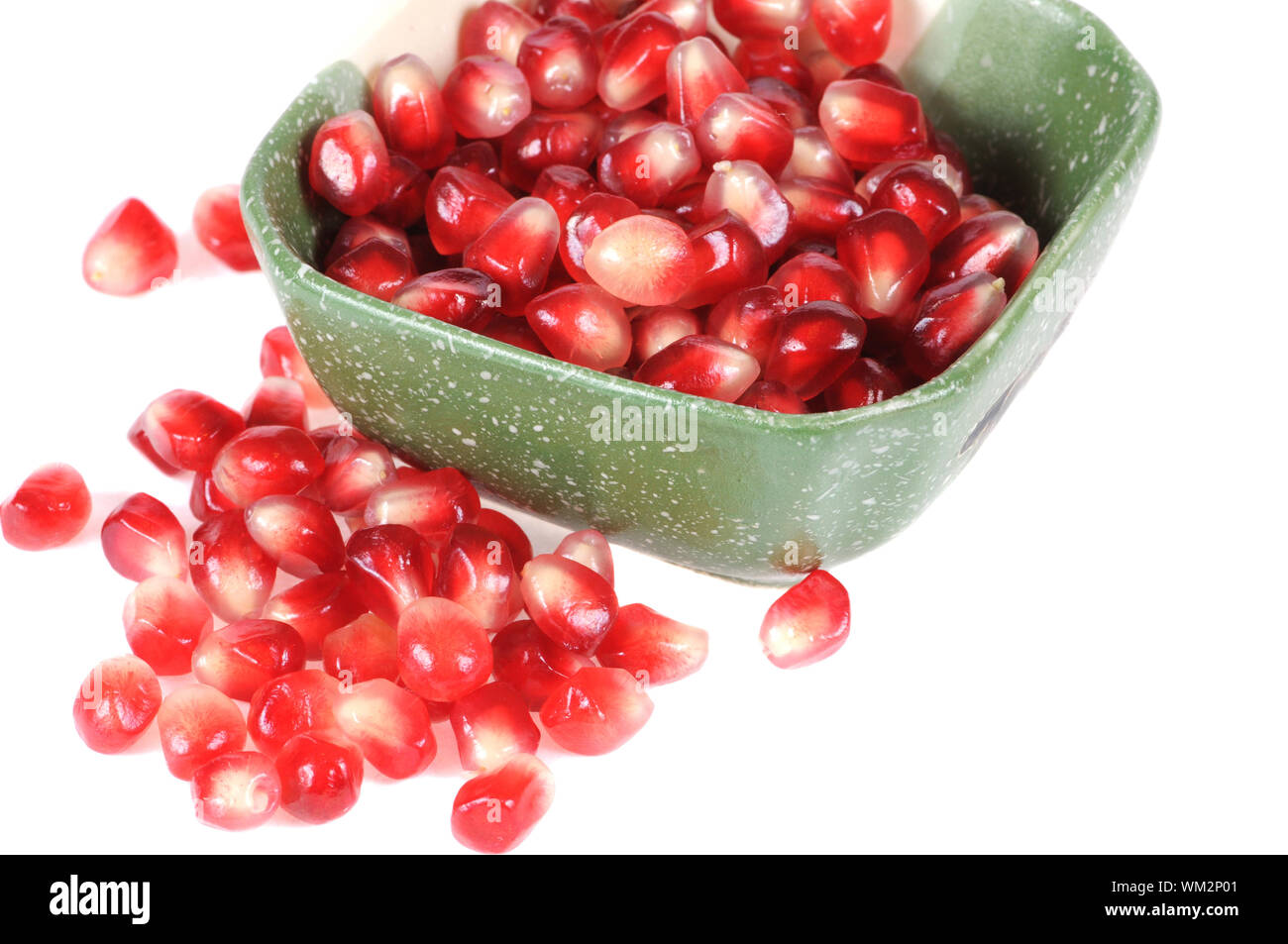 Pomegranate grains in a plate isolated on white background Stock Photo ...