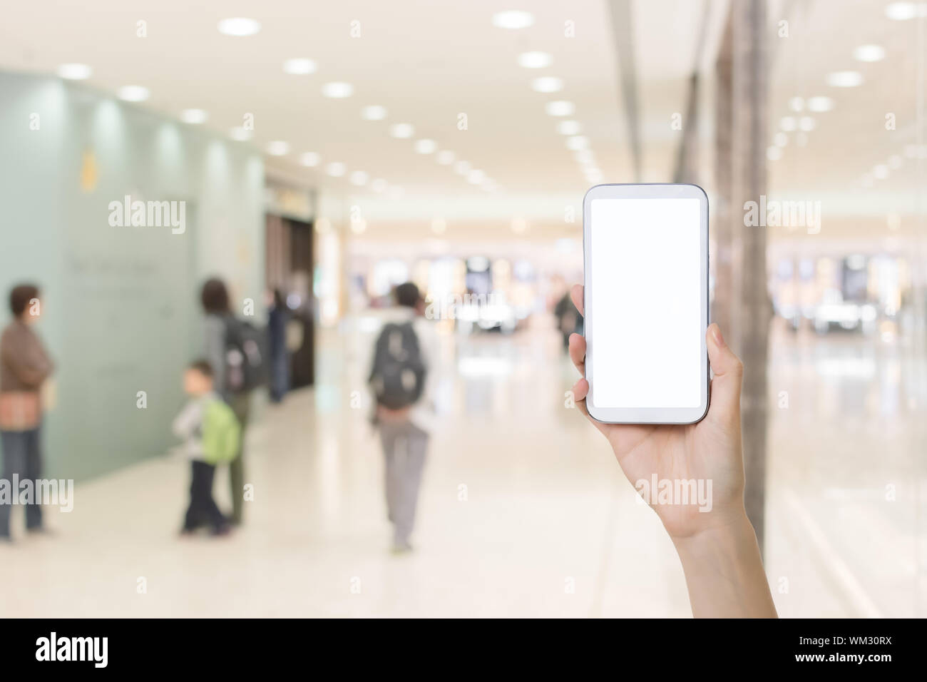 Using smartphone in a market or department store, closeup image Stock ...