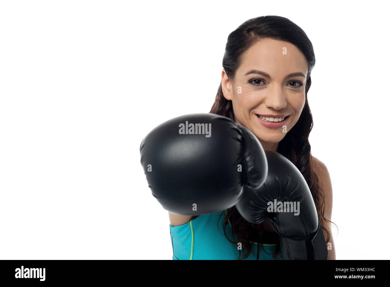 Boxing woman punching fun towards camera Stock Photo - Alamy