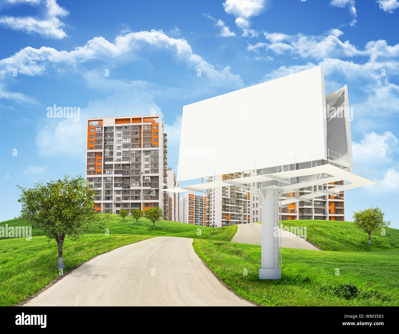 Tall buildings, green hills and road with large billboard against sky ...