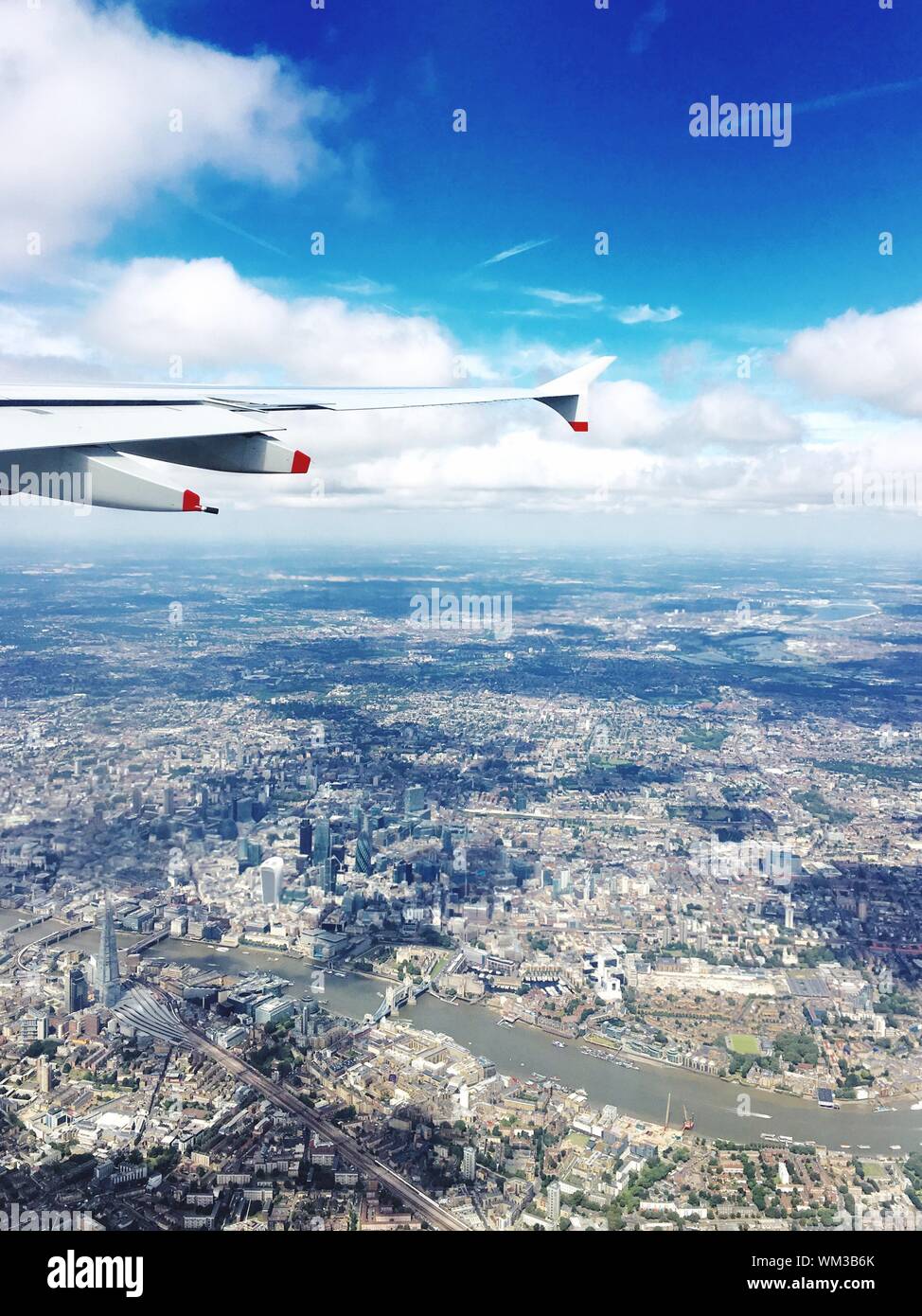 Aerial View Of Airplane Flying Over Cityscape Stock Photo - Alamy