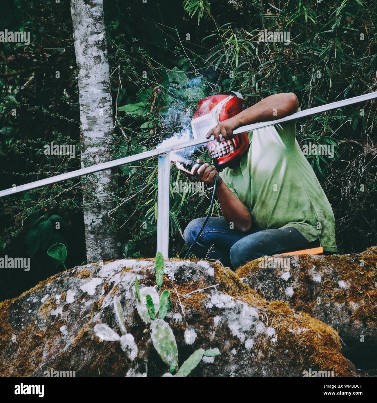 Sitting man welding hi-res stock photography and images - Alamy