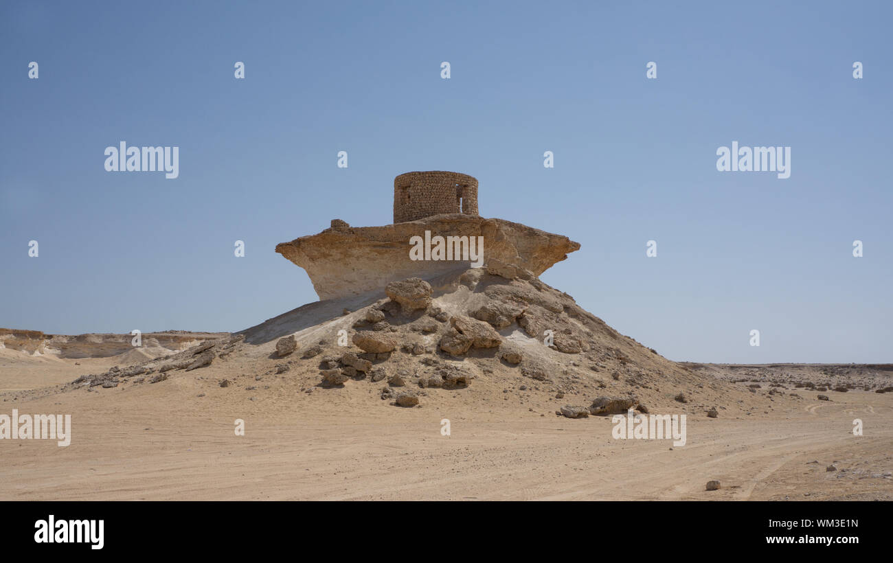 Rocks and a fortress in the desert in Doha, Qatar Stock Photo - Alamy