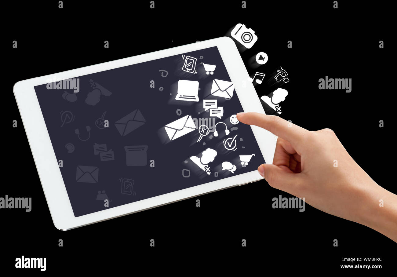 Hand touching tablet and multimedia icons Stock Photo - Alamy