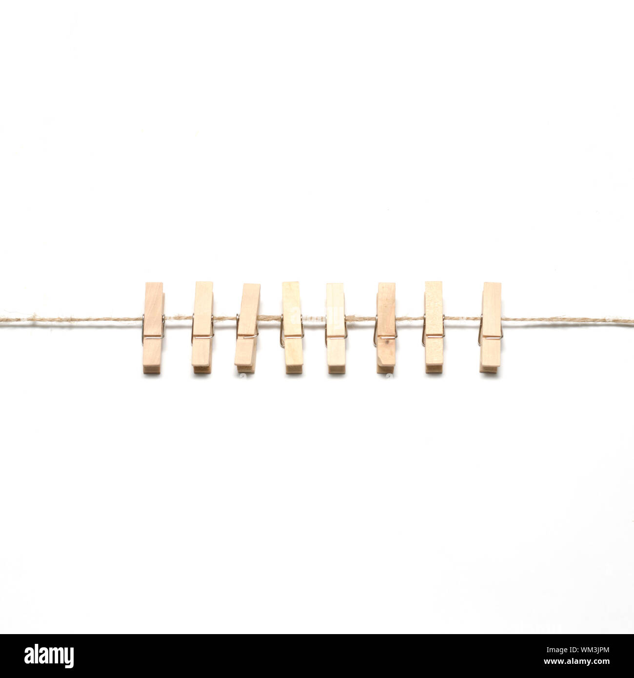 cloth pin hang with rope on a white background Stock Photo - Alamy