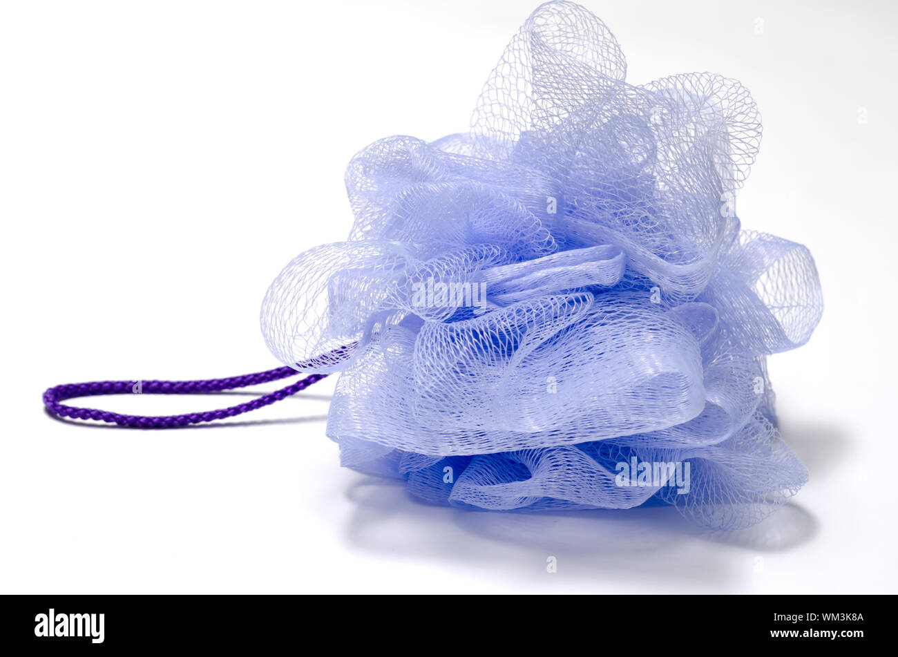 purple bath puff isolated on a white background Stock Photo - Alamy