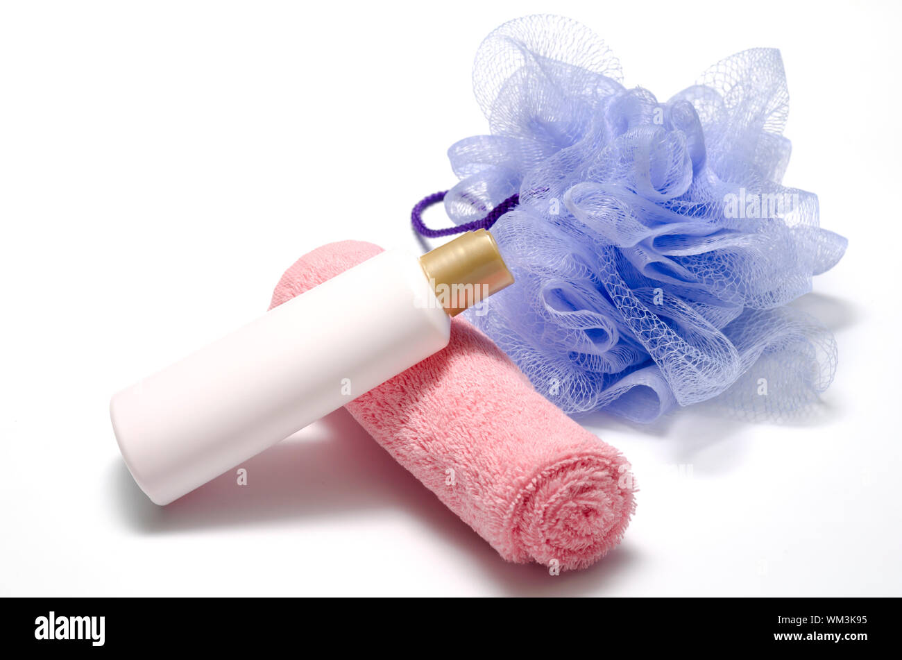 purple bath puff liquid soap and pink towel on a white background Stock ...